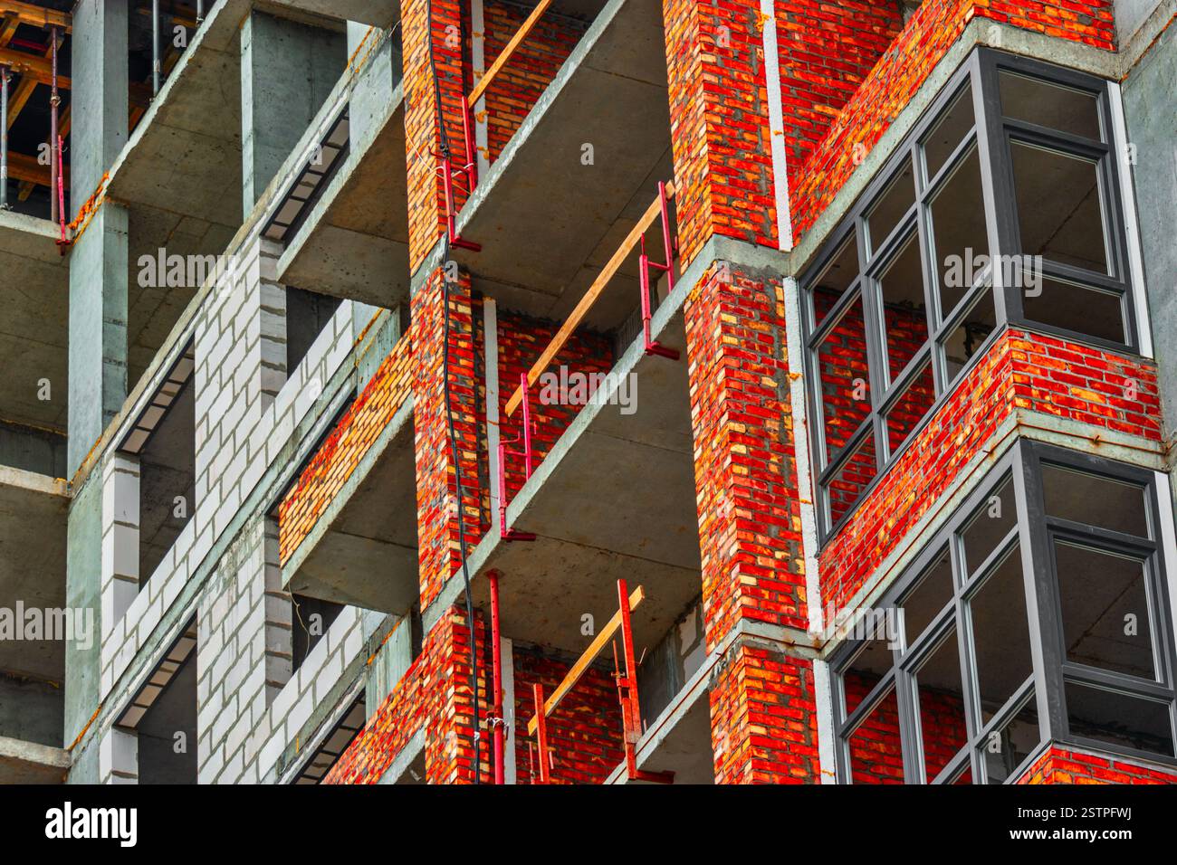 Half finished building made of monolith concrete and red bricks Stock ...