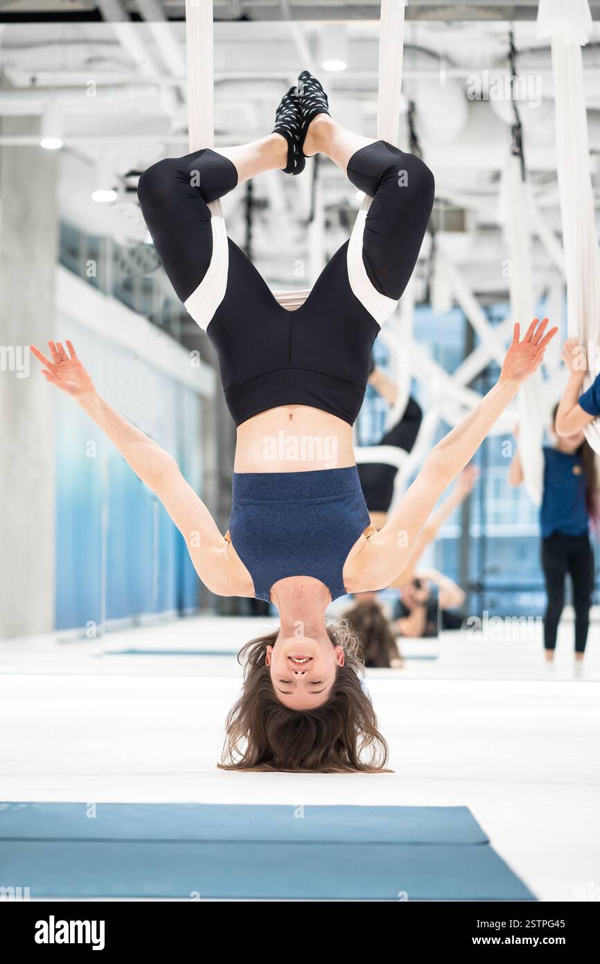 Woman hanging upside down in hi-res stock photography and images - Alamy
