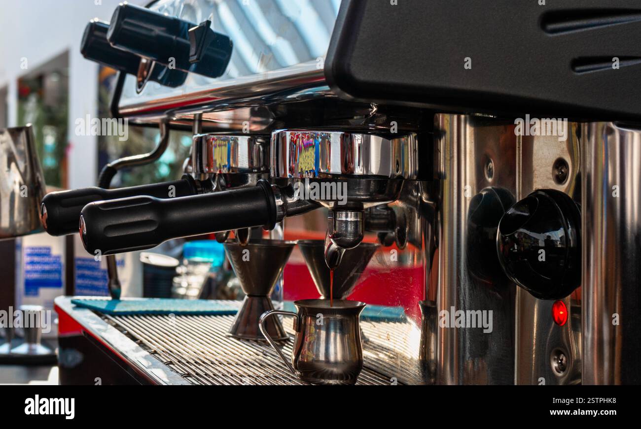 Coffee machine in coffee house producing espresso Stock Photo - Alamy