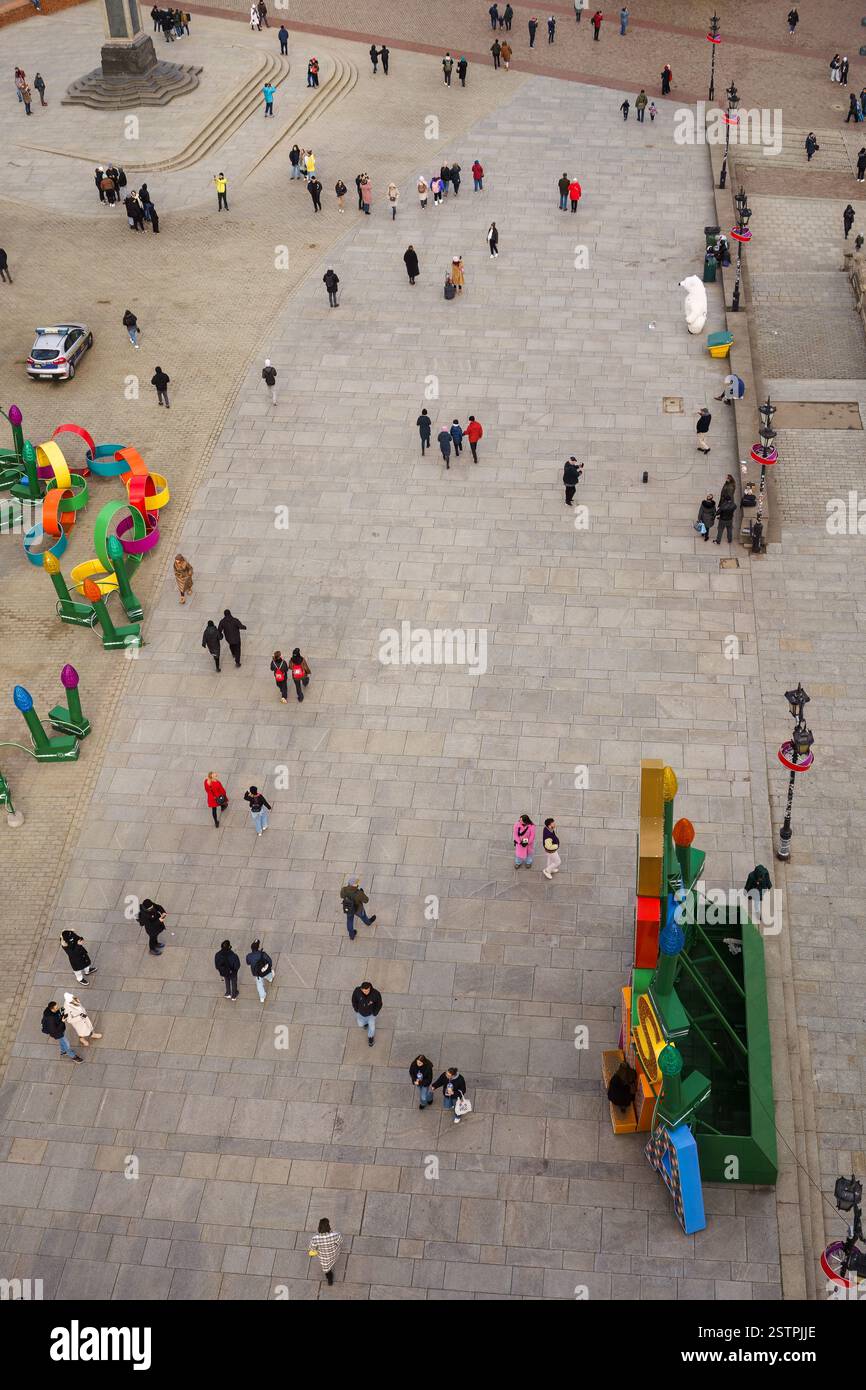 Warsaw, Poland. January 26, 2025 - Aerial view of people walking across ...