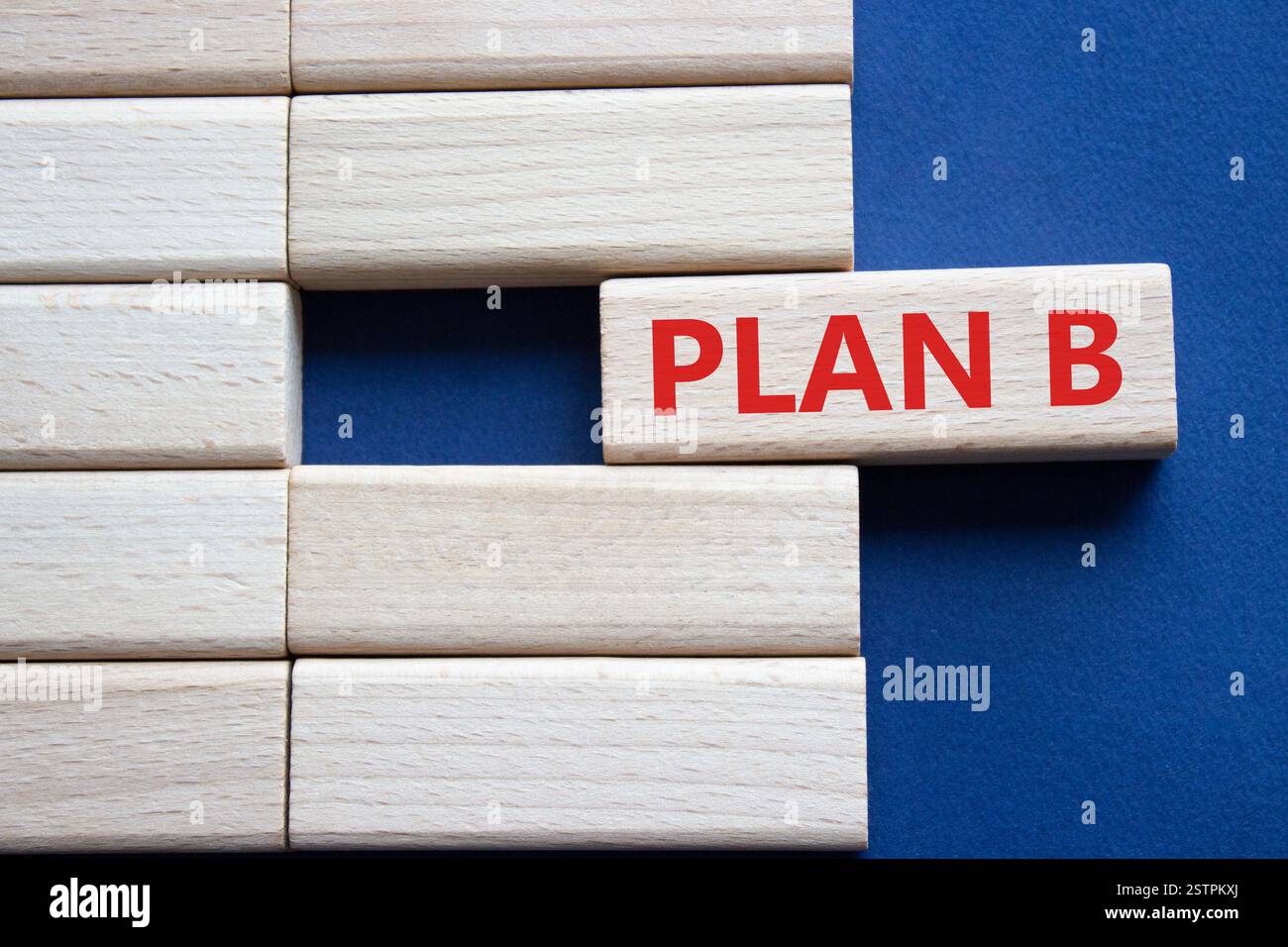 Plan B symbol. Concept word Plan B on wooden blocks. Beautiful deep blue background. Business ...
