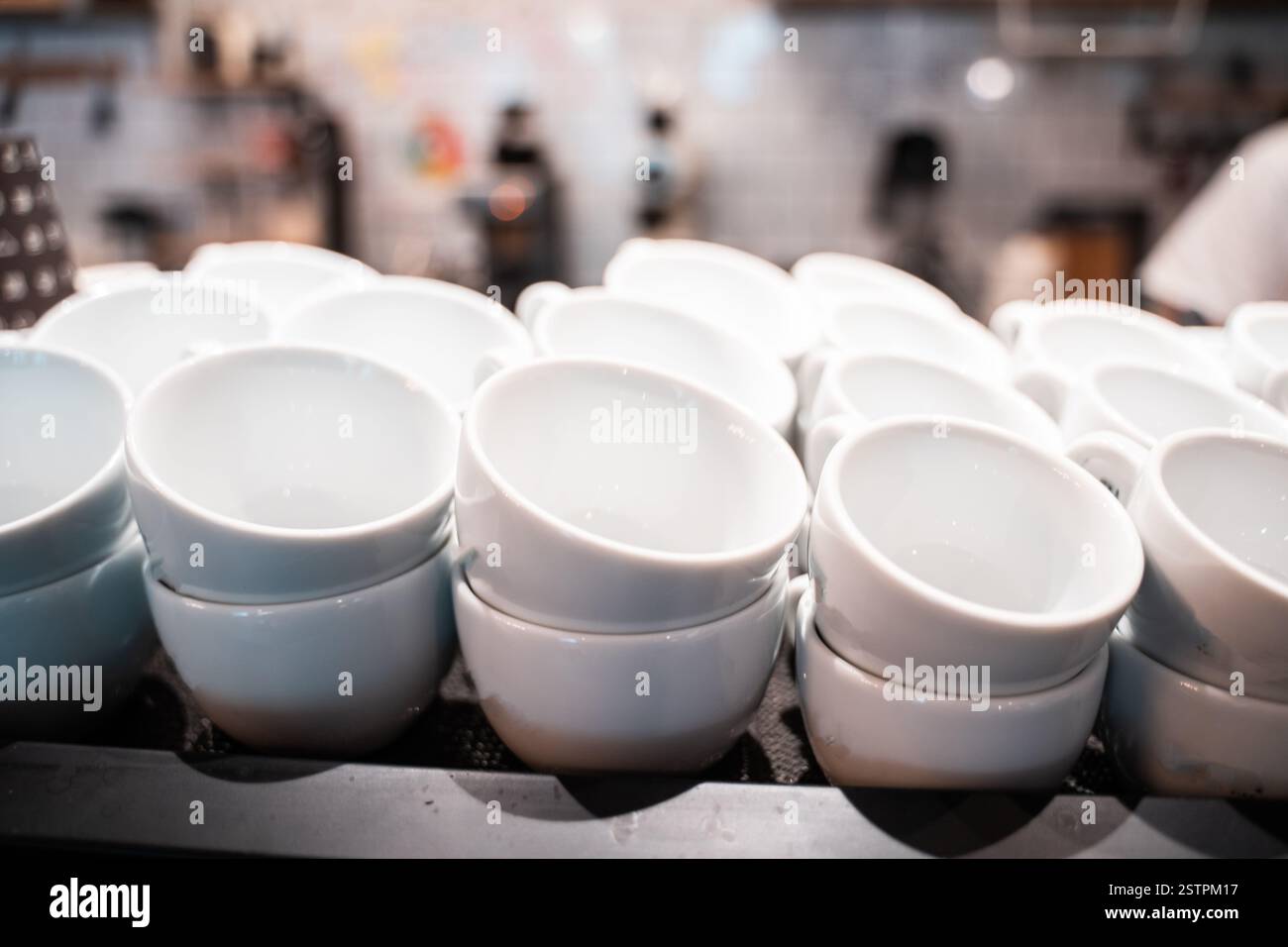Stack of small ceramic cups on shelf Stock Photo - Alamy