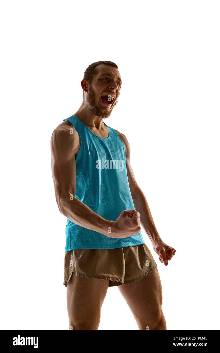 Runner celebrating victory, explosive energy and clenched fists ...