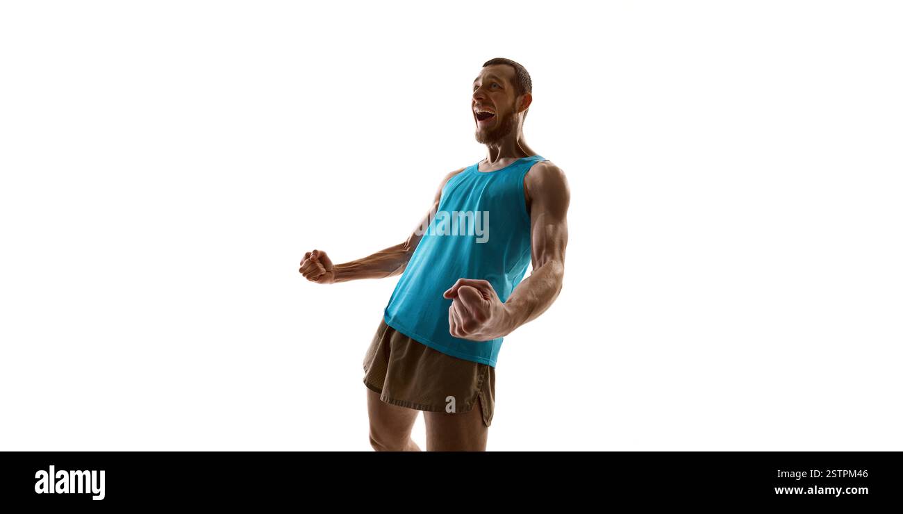 Champion expressing exhilaration, arms open and intense facial ...