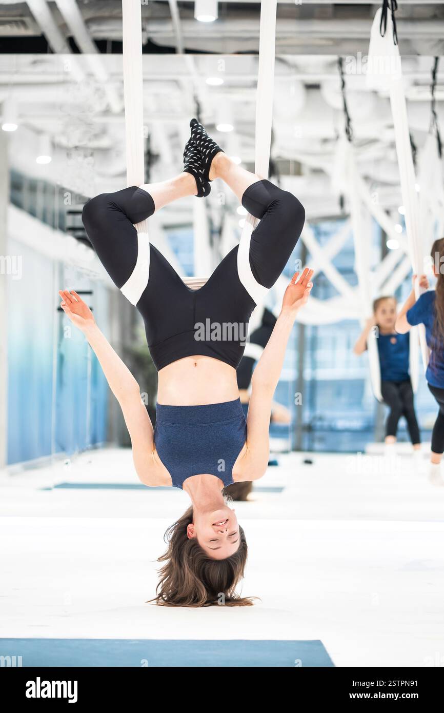 Woman hanging upside down in hi-res stock photography and images - Alamy