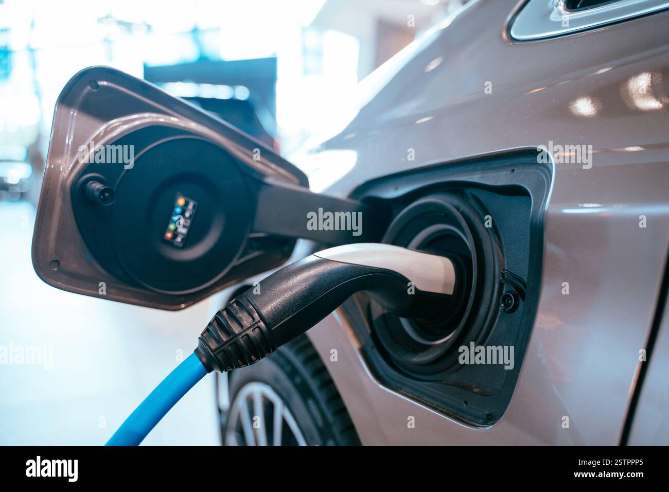 Electric Car Plug Close Up. Close up of the power supply plugged into ...