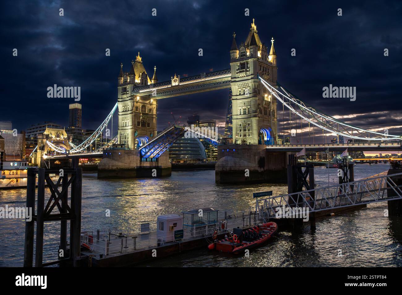 London, UK - March 23, 2024 : Tower Bridge opening up at night. The ...