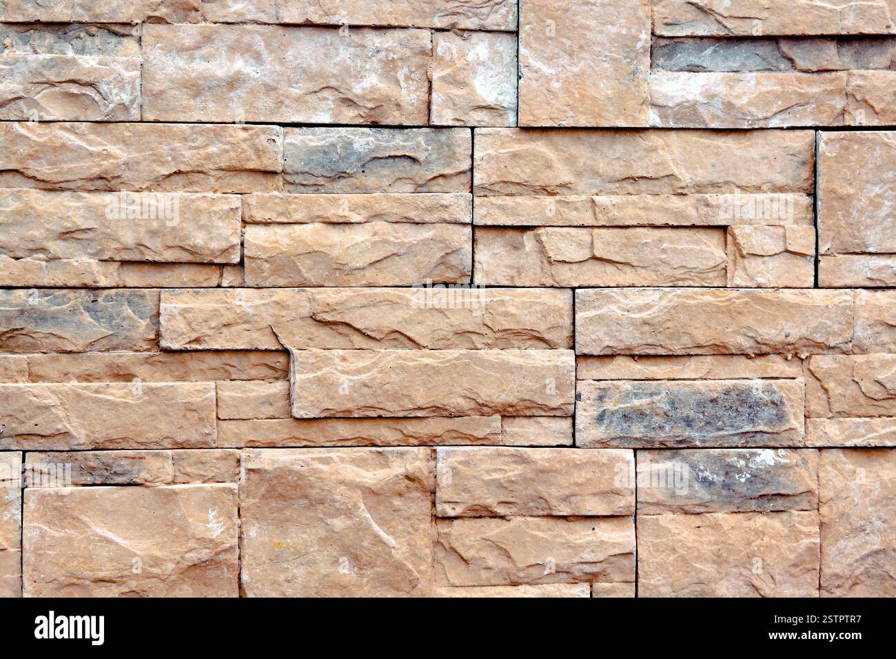 Background image of wall made of natural stone tiles hi-res stock ...
