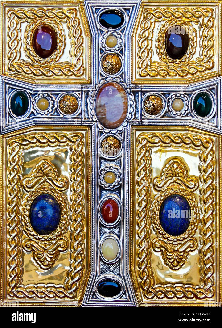 Holy Bible book in gold with cross and gems Stock Photo - Alamy