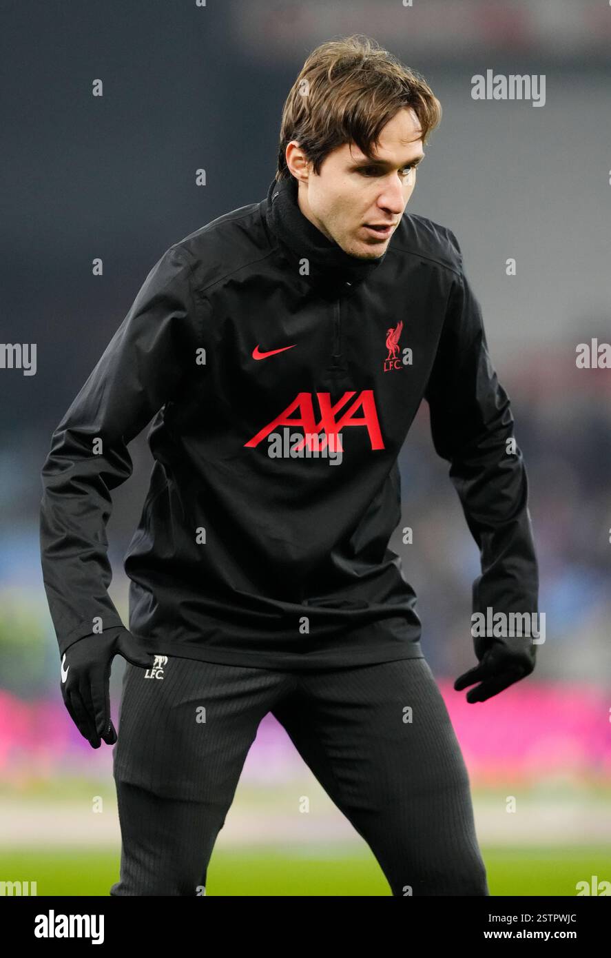 Liverpool's Federico Chiesa warms up ahead of the Premier League match ...