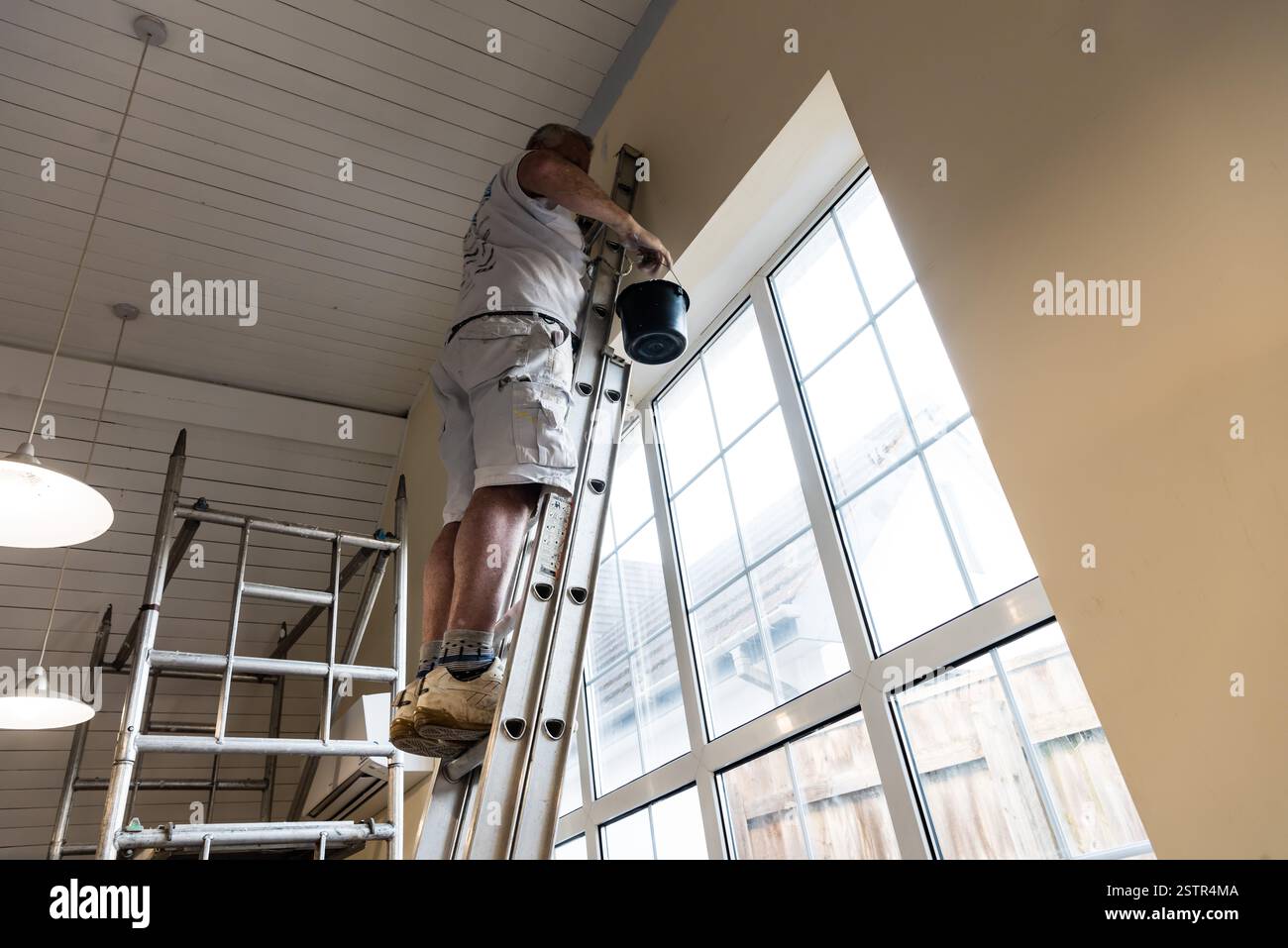 Lord Clinton cuts the ribbon and declares the shop open once more Stock ...