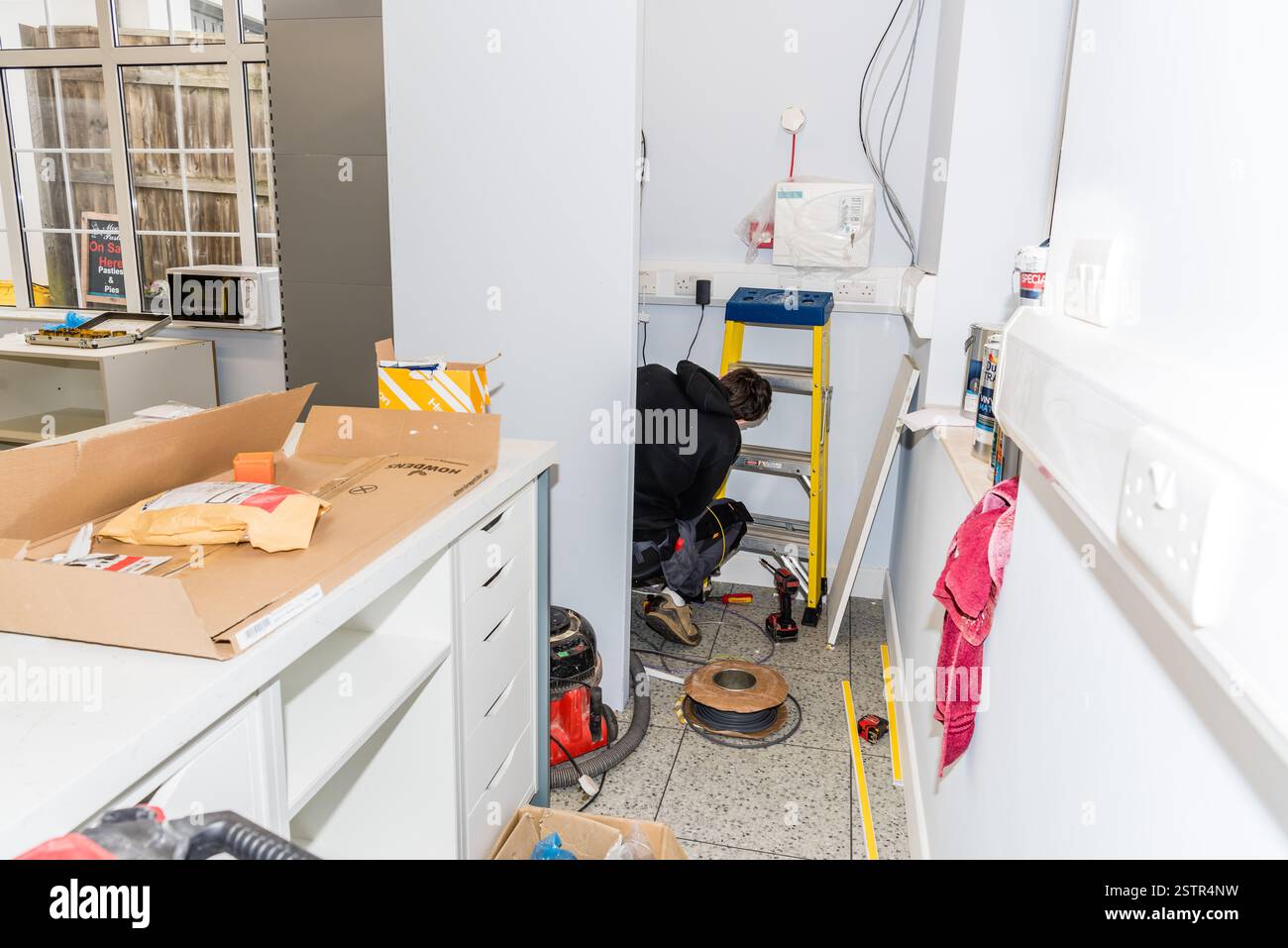 Lord Clinton cuts the ribbon and declares the shop open once more Stock ...