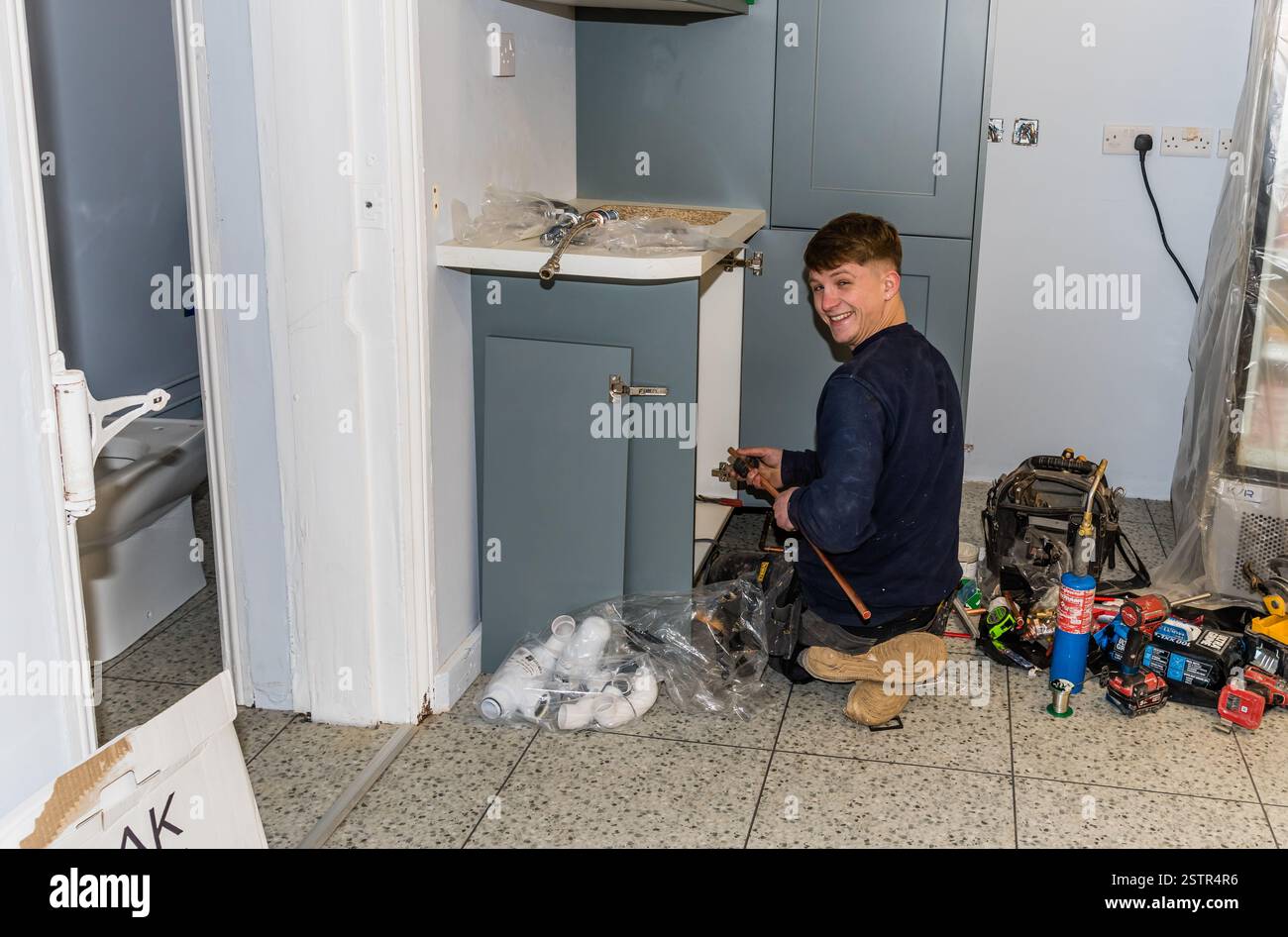 Lord Clinton cuts the ribbon and declares the shop open once more Stock ...