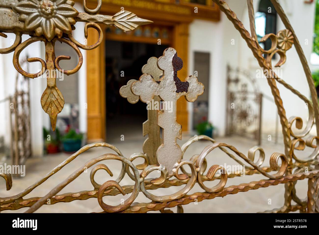 Detail of an ornate church fence. Christian metal symbols as decoration ...