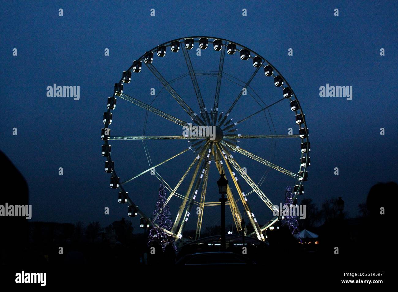 Ferris wheel illuminated against a dark sky. Night scene, entertainment ...