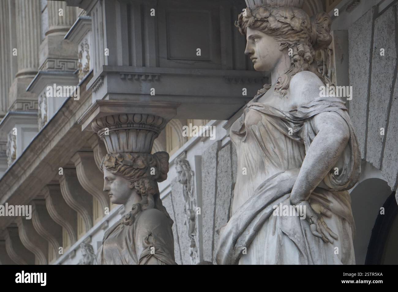 The statues of two beautiful women grace the columns or pillars on the ...