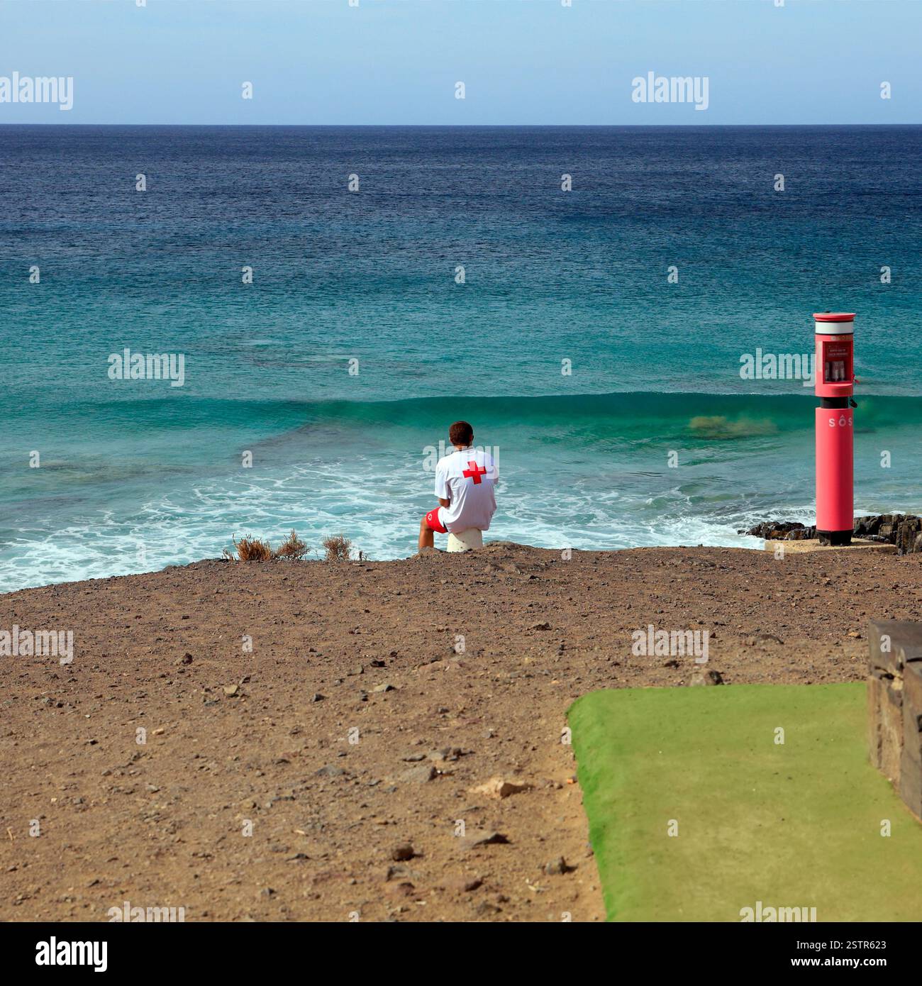Lifeguard keeping watch over Piedra Playa surf beach, Fuerteventura ...