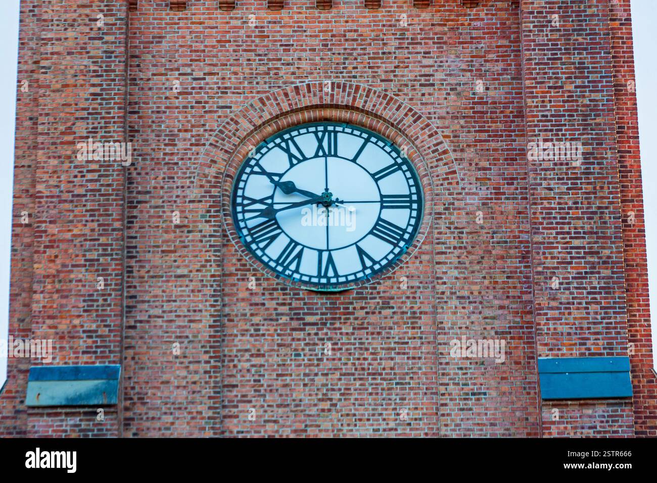 Brick wall with clock hi-res stock photography and images - Alamy