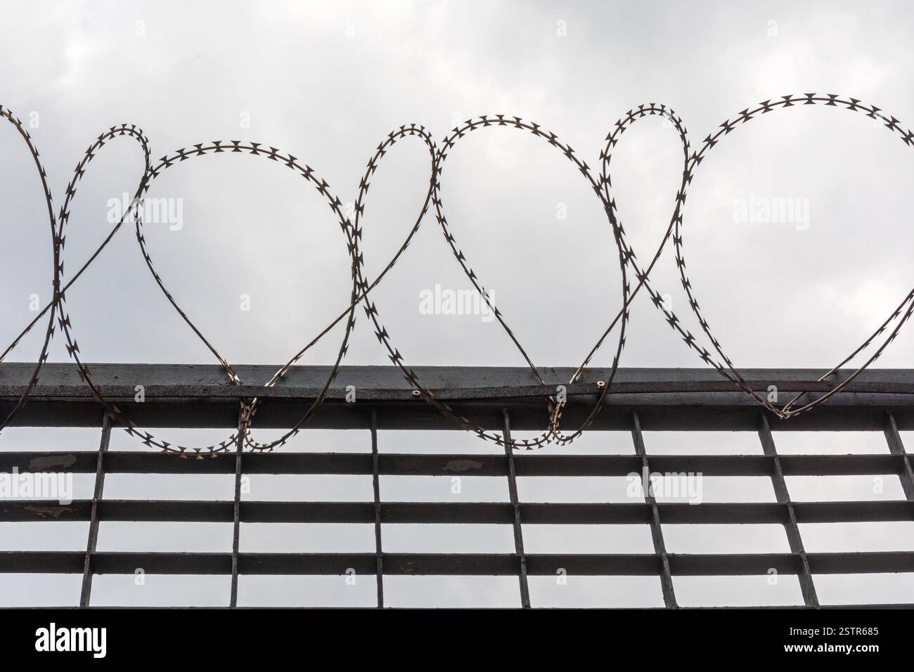 Razor Wire at Top of Fence Protection Stock Photo - Alamy