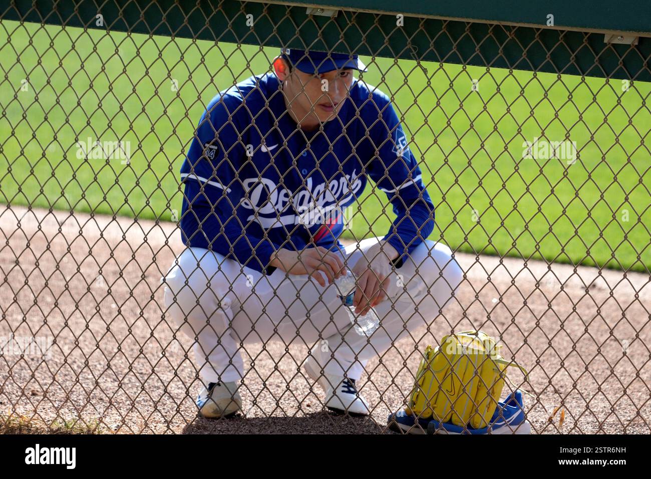 Los Angeles Dodgers pitcher Roki Sasaki warms up before his first live ...