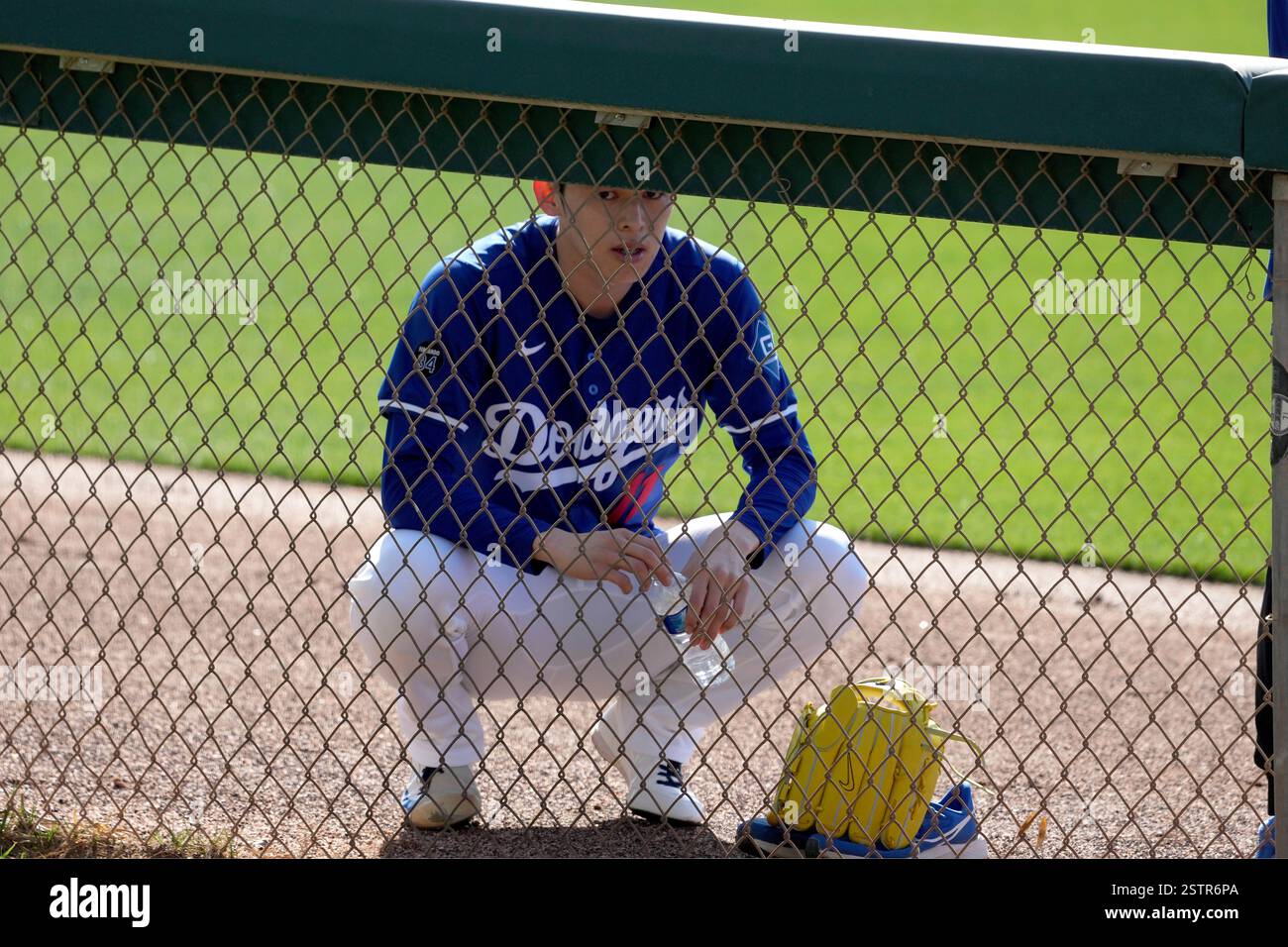 Los Angeles Dodgers pitcher Roki Sasaki warms up before his first live ...