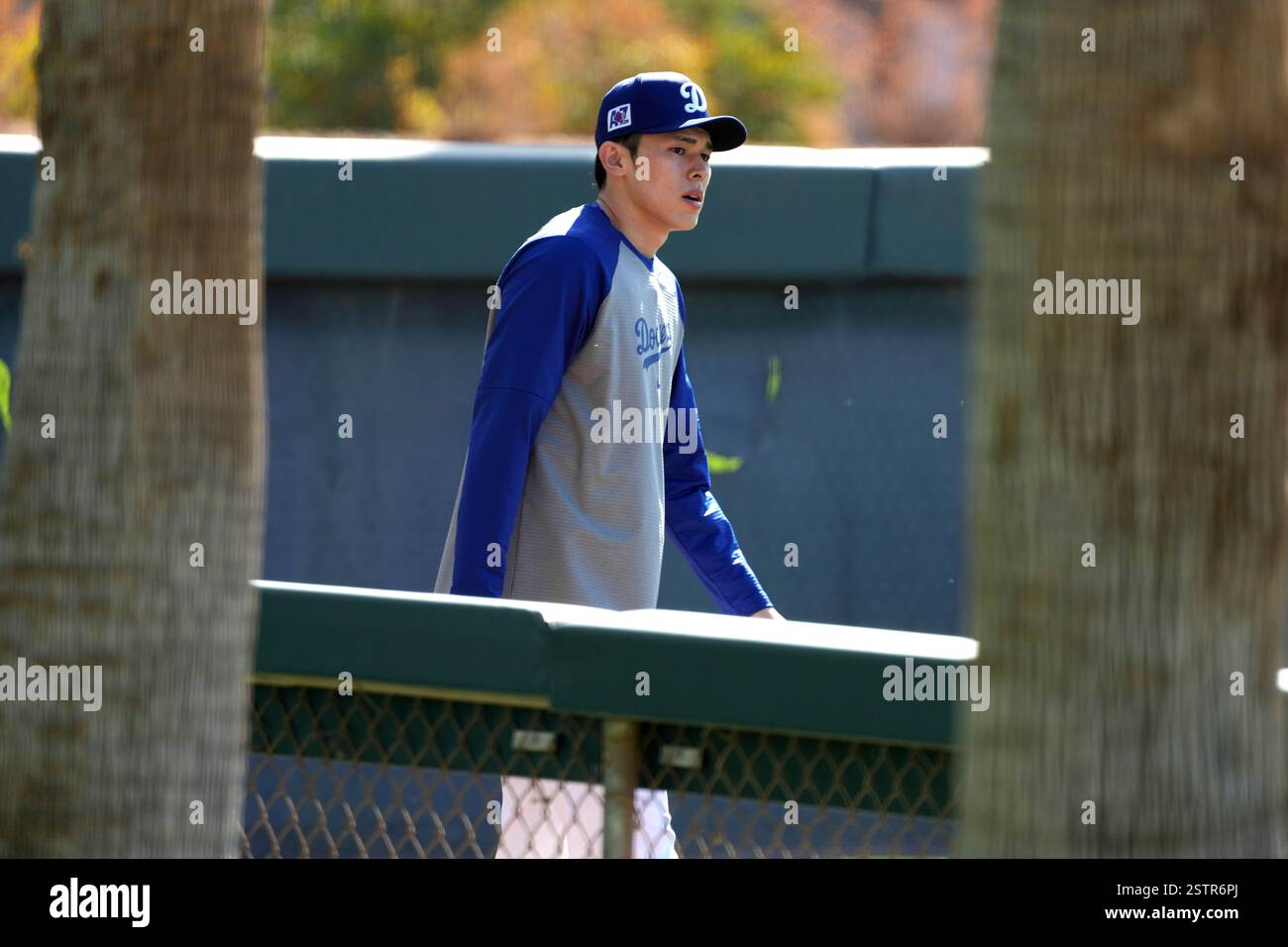 Los Angeles Dodgers pitcher Roki Sasaki warms up before his first live ...