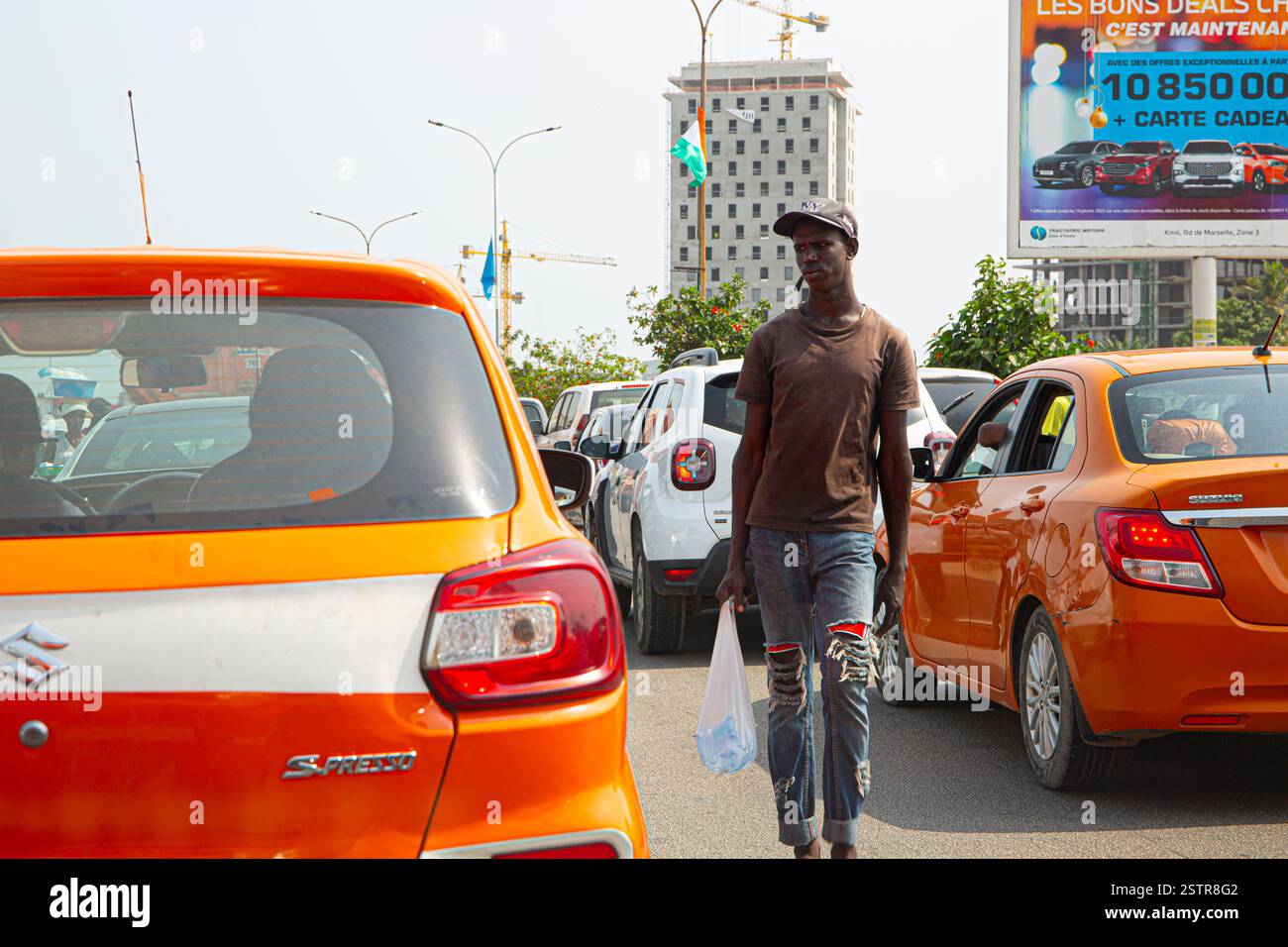 Road sellers in Abidjan, Ivory-Coast is one of the risky business that ...