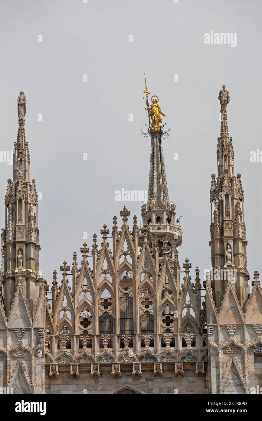 Gold statue of duomo cathedral in milan italy hi-res stock photography ...