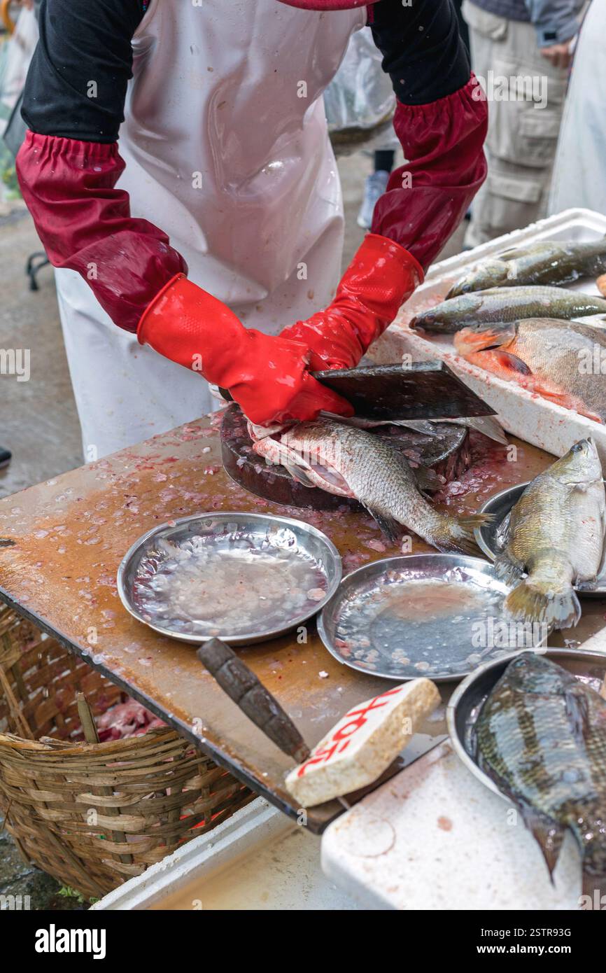 Preparing and Cutting Fish With Cleaver at Market Stall Stock Photo - Alamy