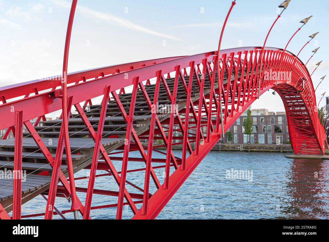 Red Python Bridge at Eastern Docklands in Amsterdam Stock Photo - Alamy