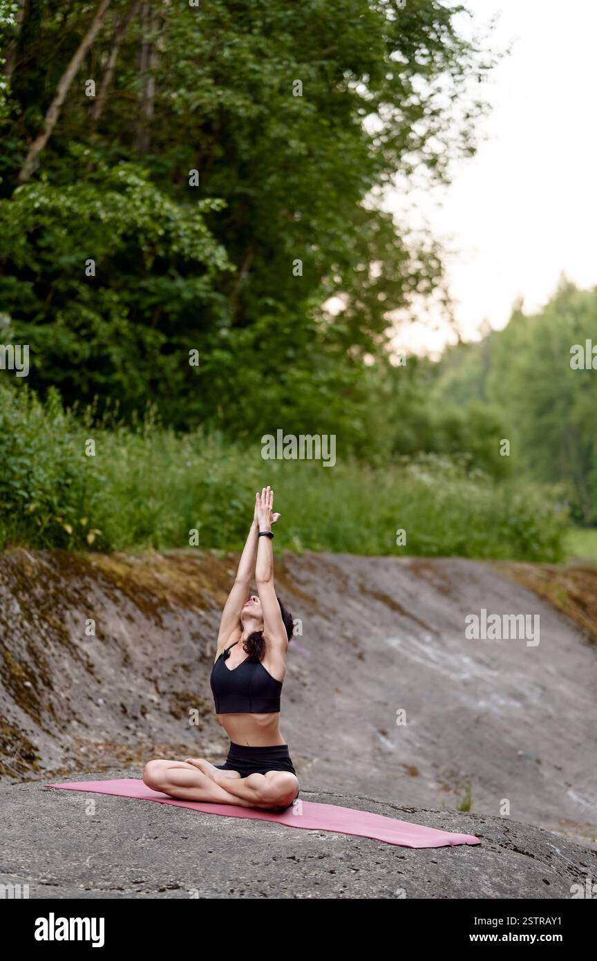 Yoga cross legged palms together hi-res stock photography and images ...