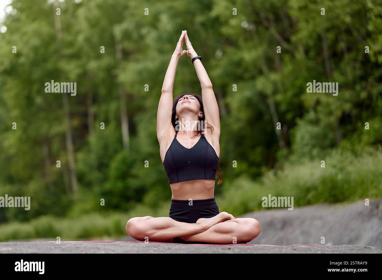 Yoga cross legged palms together hi-res stock photography and images ...