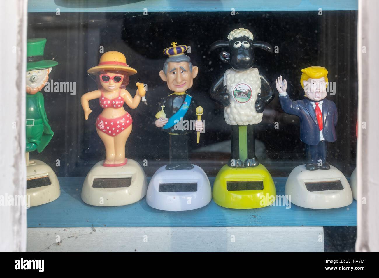 Selection of solar powered figurines in a window, including of King ...