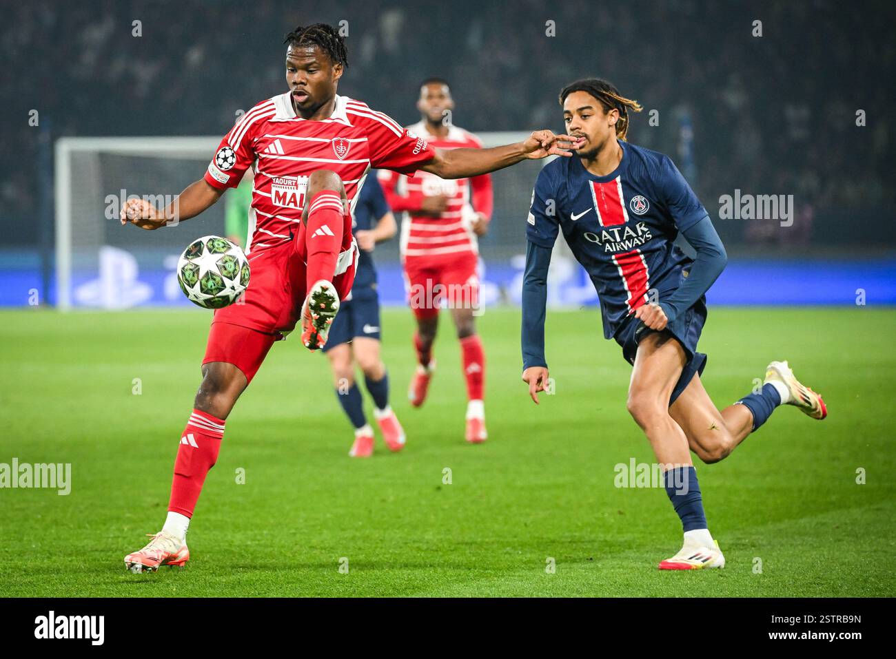 Luck ZOGBE of Brest and Bradley BARCOLA of PSG during the UEFA ...