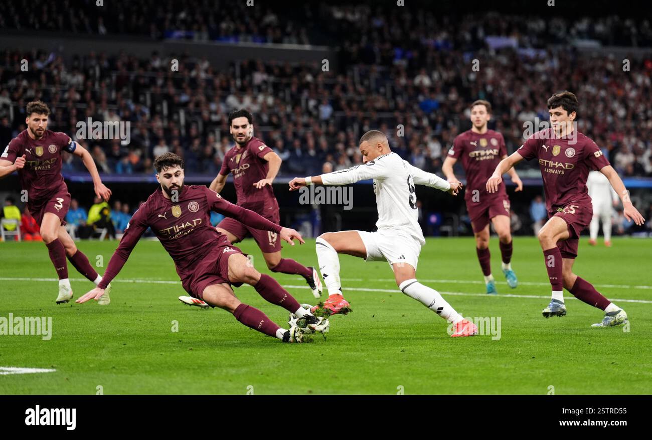 Real Madrid's Kylian Mbappe beats Manchester City's Josko Gvardiol ...