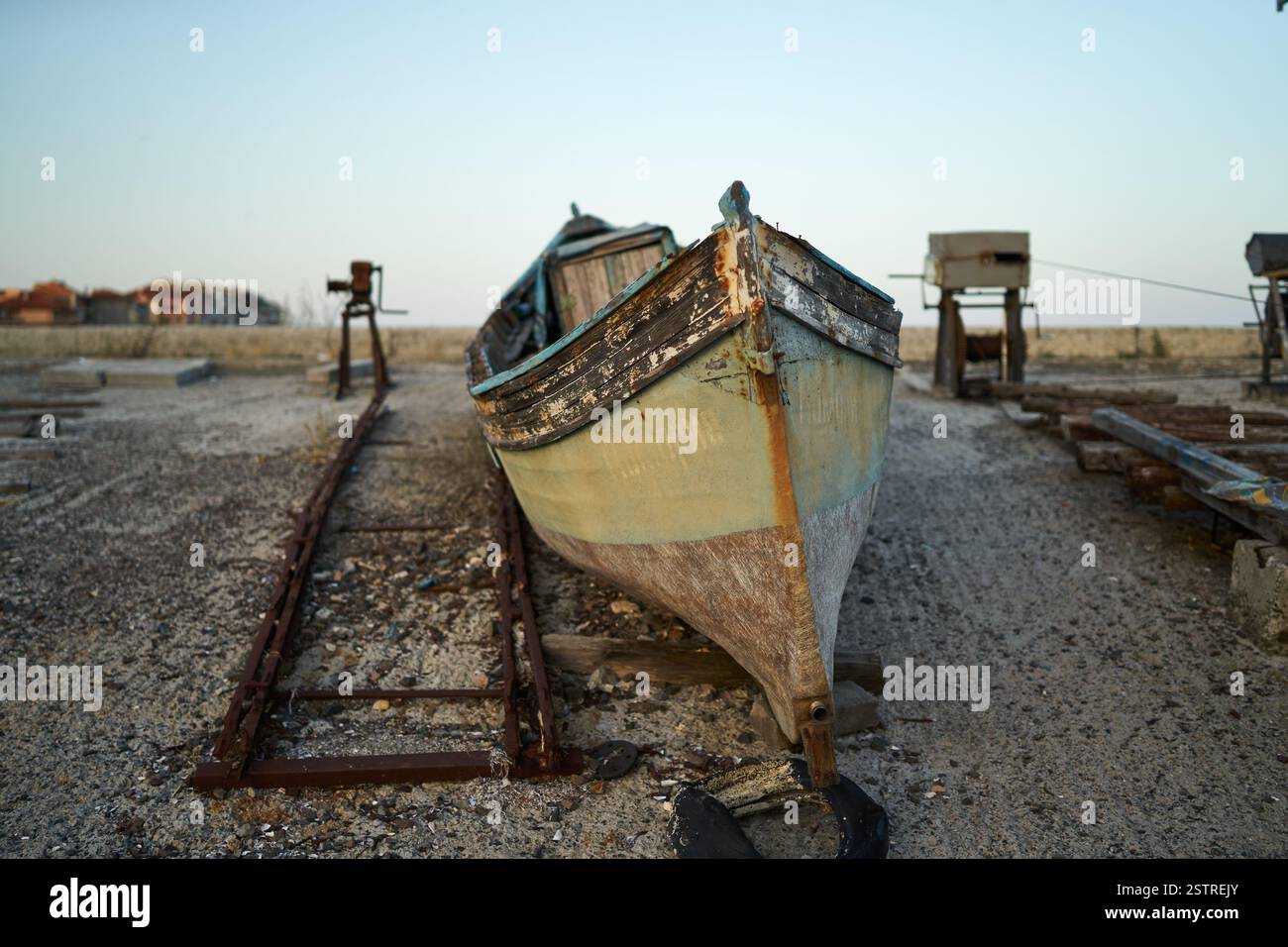 The old fishermen's boat stand on the shore of the seaport Stock Photo ...