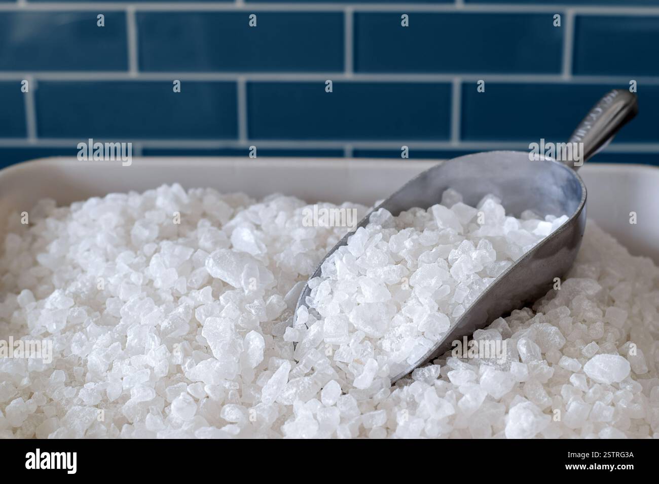 Container with water softener salt with a scoop Stock Photo - Alamy