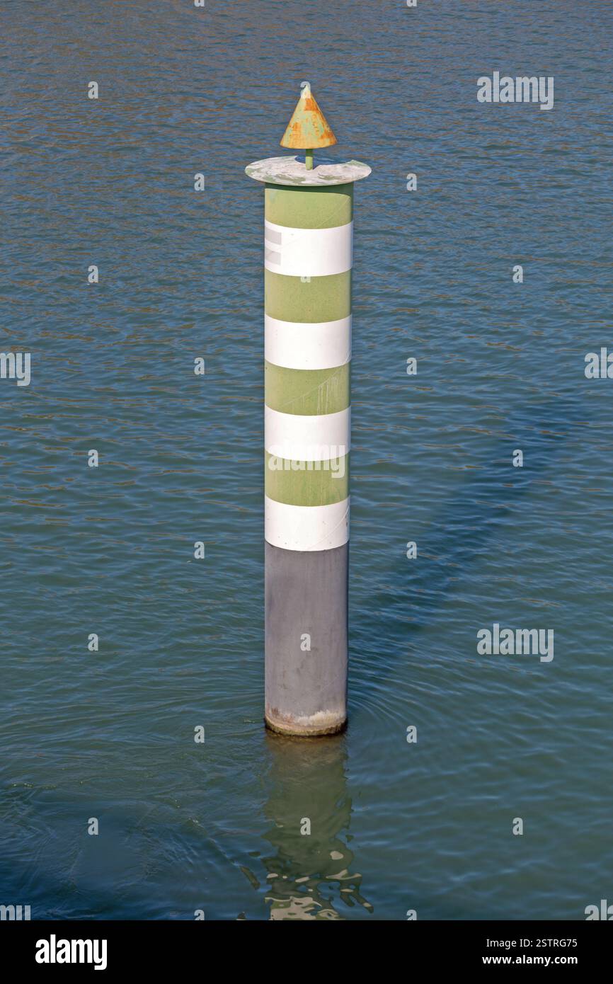 Green and white navigation pillar in river hi-res stock photography and ...