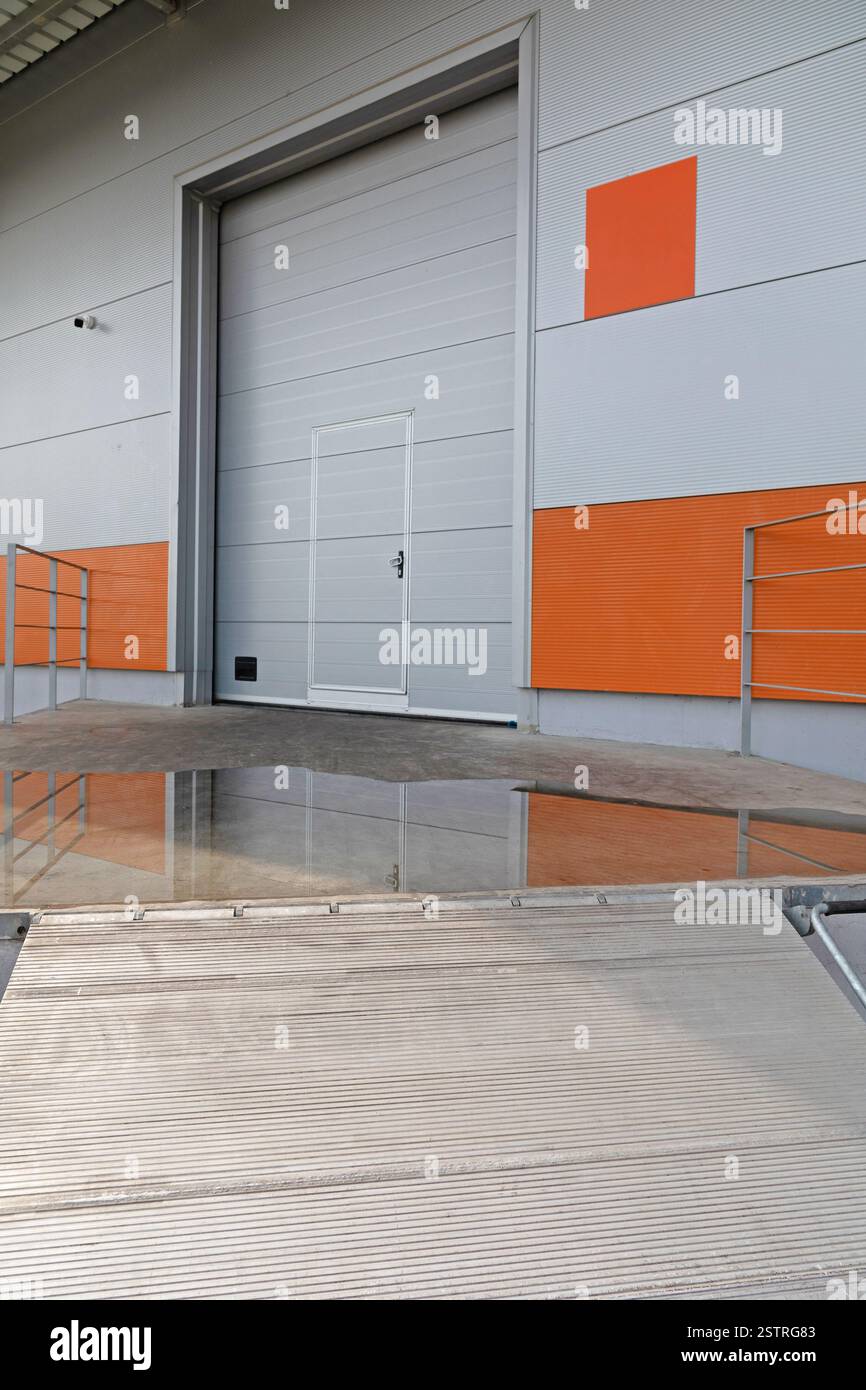 Cargo loading door ramp at distribution warehouse depot hi-res stock ...
