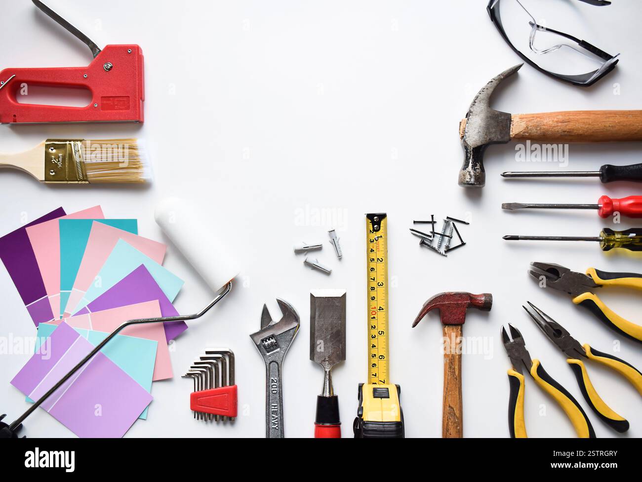 Home improvement and carpentry tools display on white background with ...