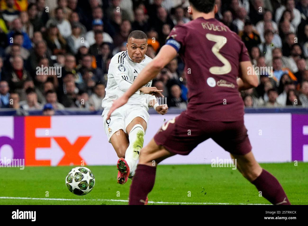 Real Madrid's Kylian Mbappe shoots to score his sides third goal during ...
