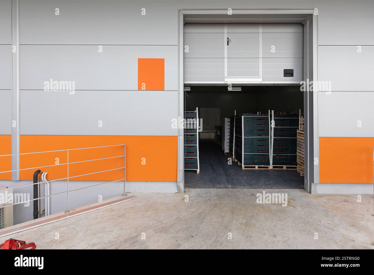 Cargo loading door ramp at distribution warehouse depot hi-res stock ...