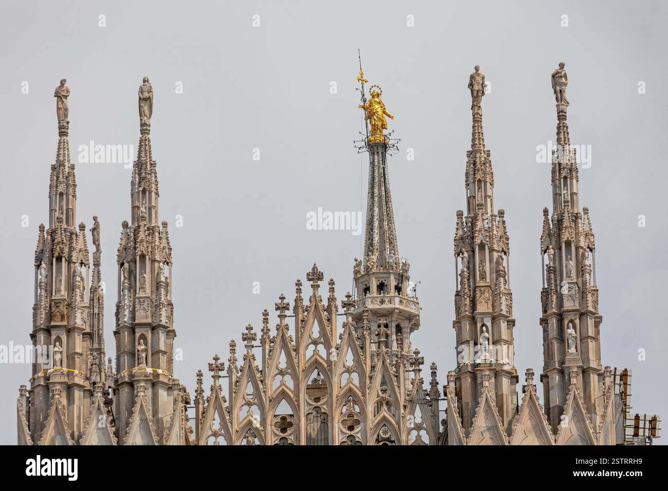 Golden statue at top of duomo cathedral in milan italy hi-res stock ...