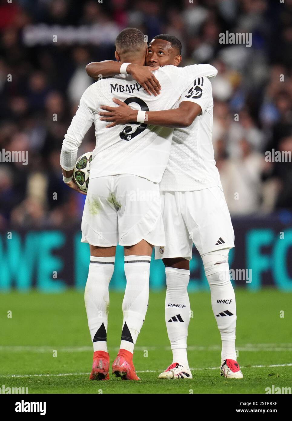 Real Madrid's Kylian Mbappe with the match ball embraces team-mate ...