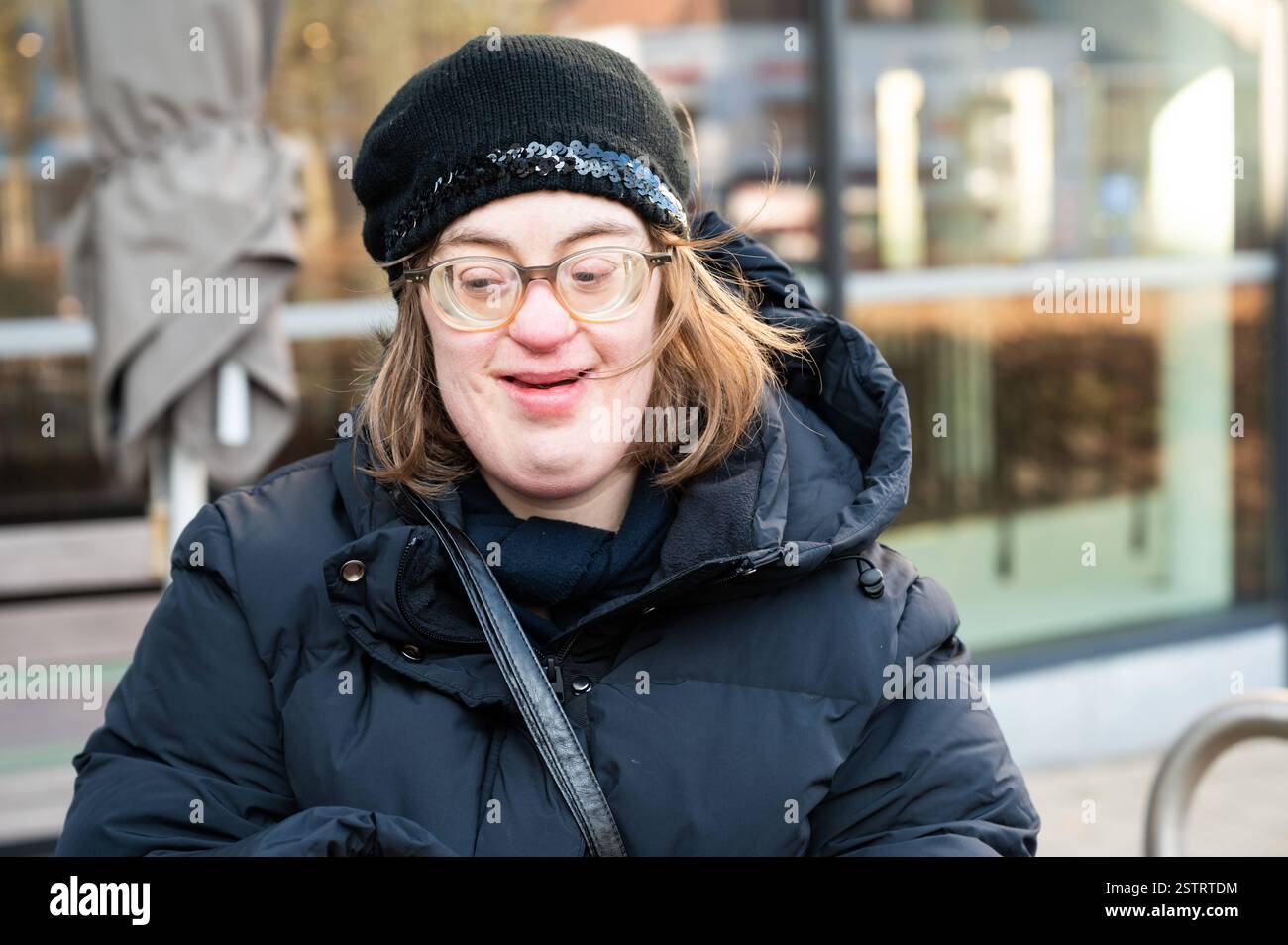 Happy 42 yo woman with the Down Syndrome wearing a bonnet and winter ...