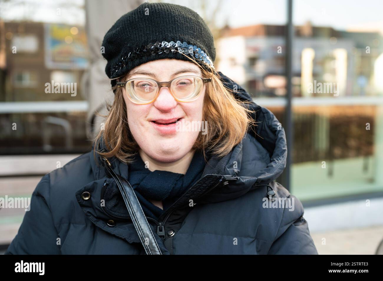 Happy 42 yo woman with the Down Syndrome wearing a bonnet and winter ...