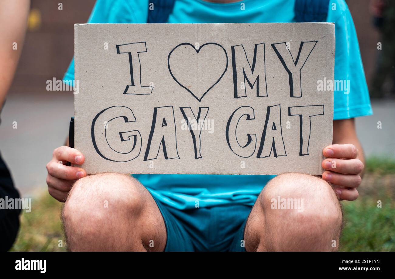 The guy holds a poster at the LGBT rally, I love my gay cat Stock Photo ...