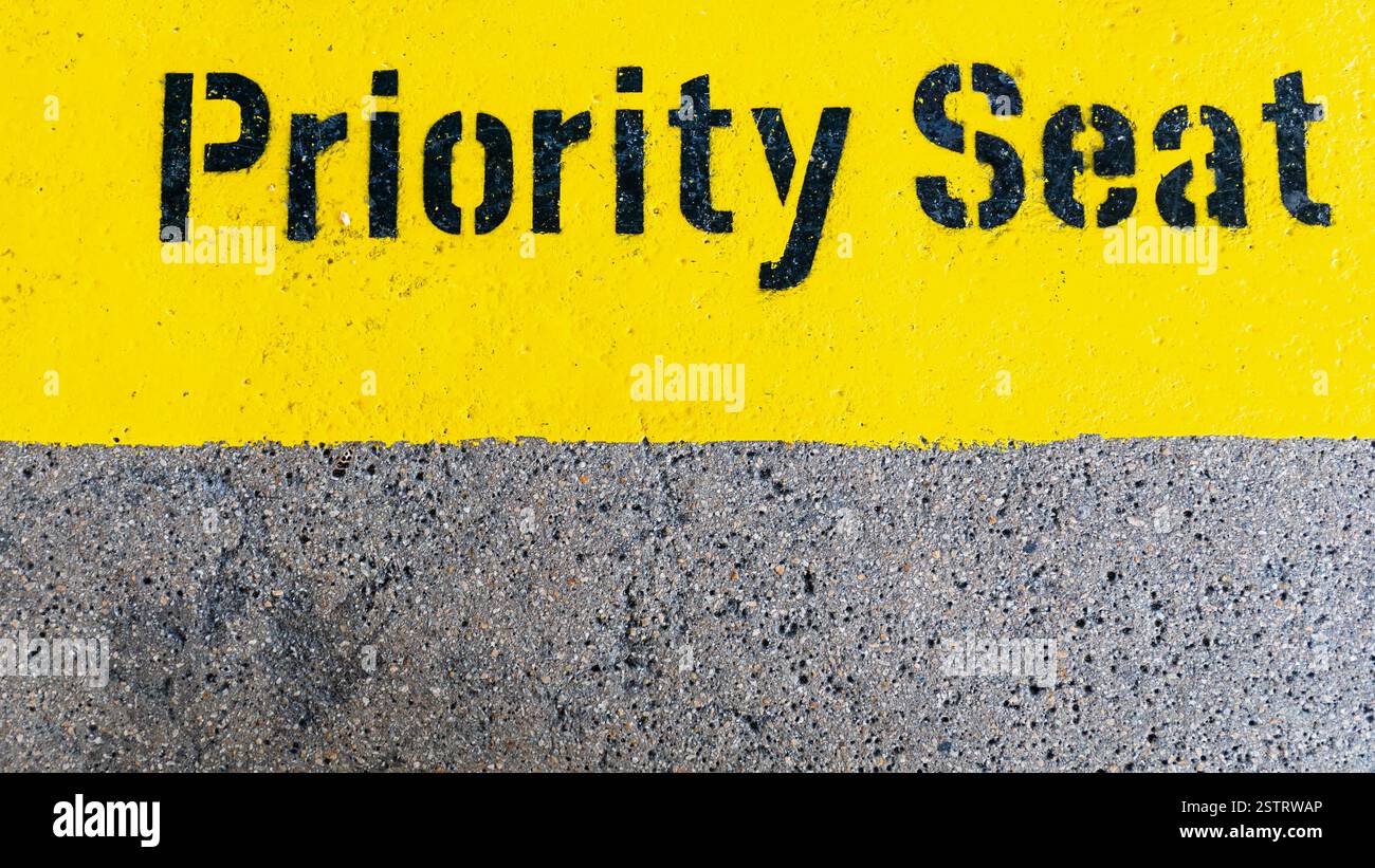 Priority Seat Yellow Sign Stock Photo - Alamy