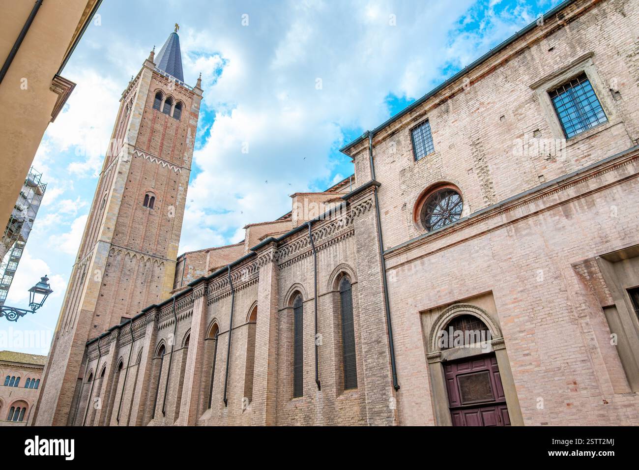 Parma Cathedral towering over Via Madre Anna Maria Adorni in Emilia ...