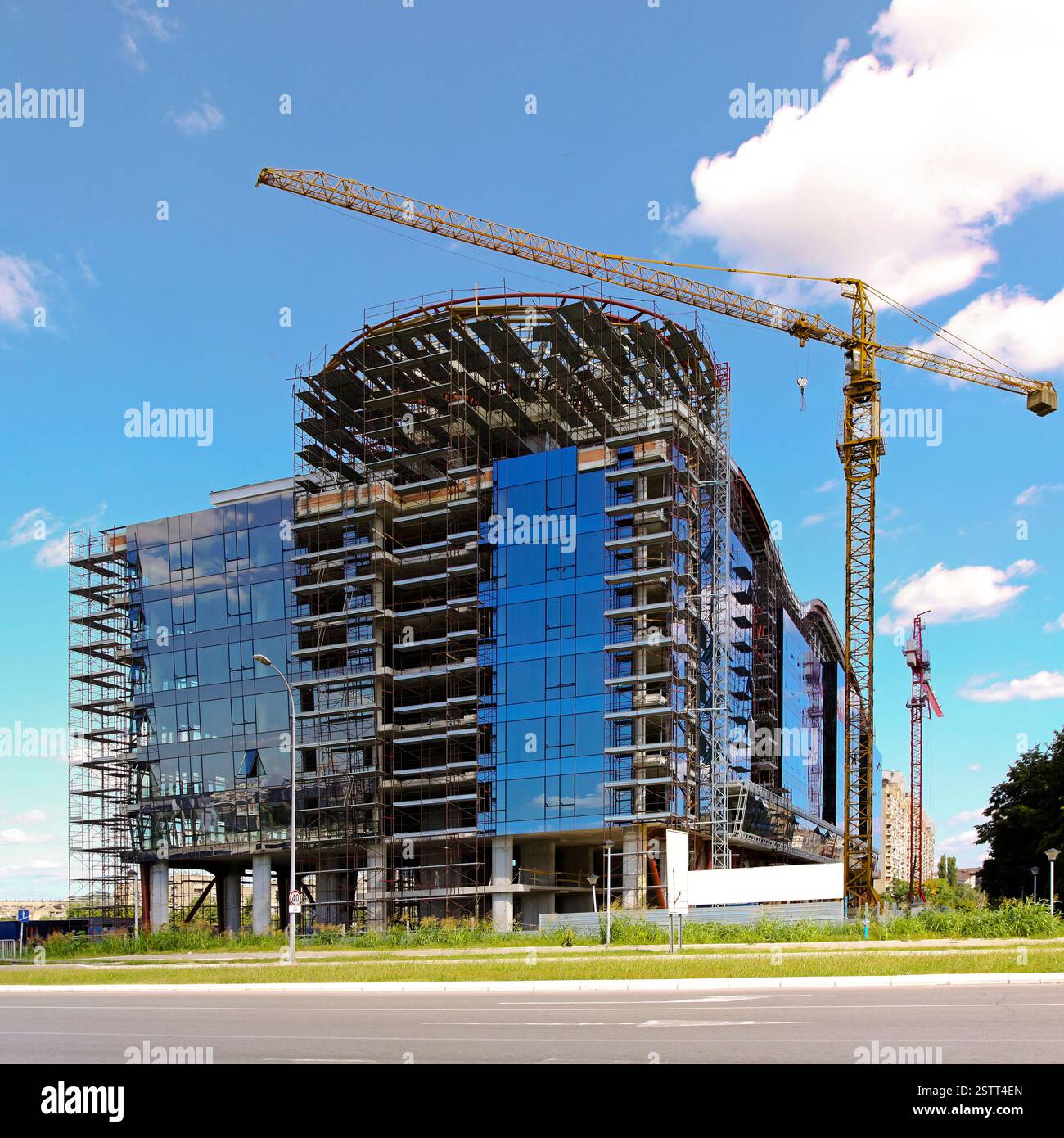 Commercial building with blue windows under construction Stock Photo ...